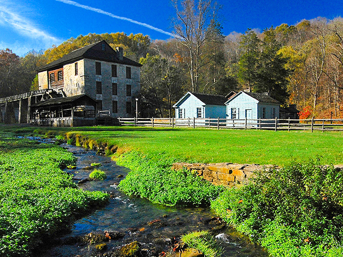 The historic grist mill stands proudly beside a bubbling stream, like a postcard from the past waiting to be explored.