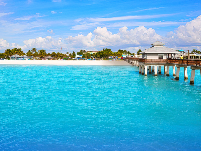 Fort Myers' pristine beaches stretch like nature's welcome mat, where turquoise waters meet powdery sand and pier-strolling becomes an art form.