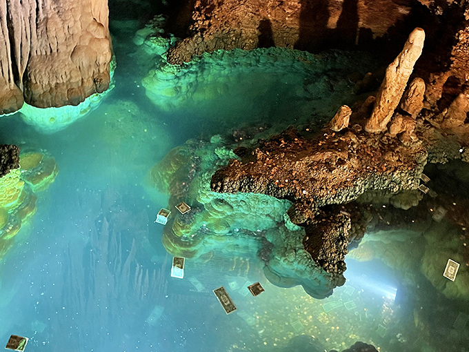 The ethereal turquoise waters of Luray's "Wishing Well" pool, where modern coins shimmer beneath the surface like underwater constellations. Mother Nature's version of Vegas fountains, but with a million-year light show.