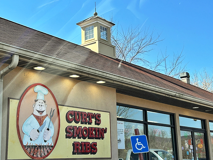 That iconic chef logo promises what awaits inside: barbecue so good it might make you consider moving to Mill Hall permanently.