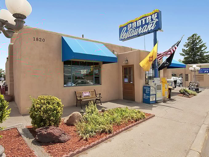 The iconic blue awning and vintage sign of The Pantry stand like a beacon of culinary hope on Cerrillos Road. Santa Fe's adobe charm meets comfort food paradise.