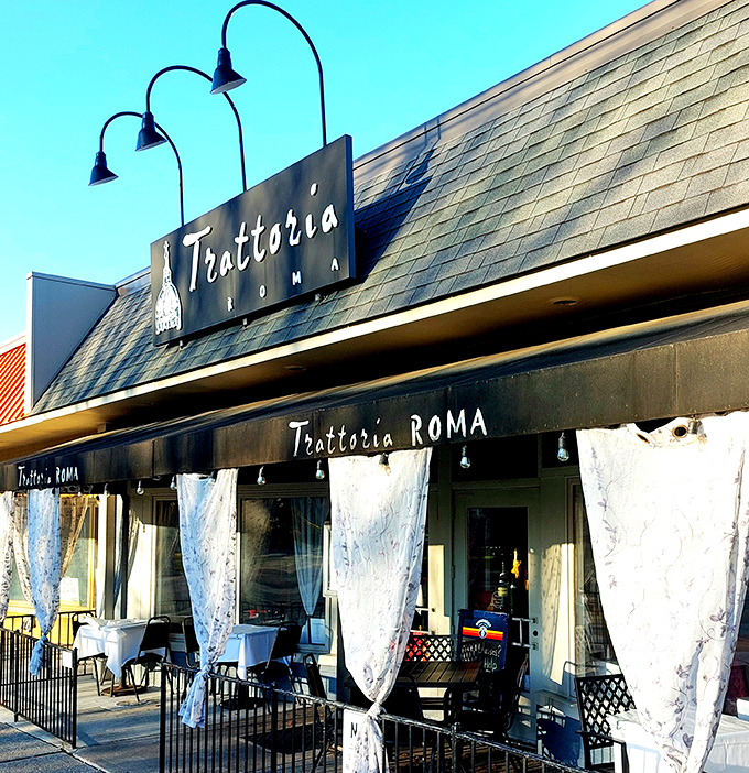 Those white curtains aren't just for show – they're practically waving you inside for dinner.