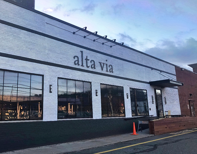 Alta Via's crisp white exterior beckons like a blank canvas, promising culinary masterpieces within its unassuming Pittsburgh walls.