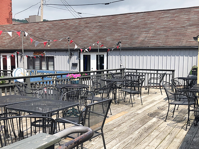 The outdoor deck at Governors' Pub offers a perfect summer escape, complete with festive bunting and wrought-iron charm.