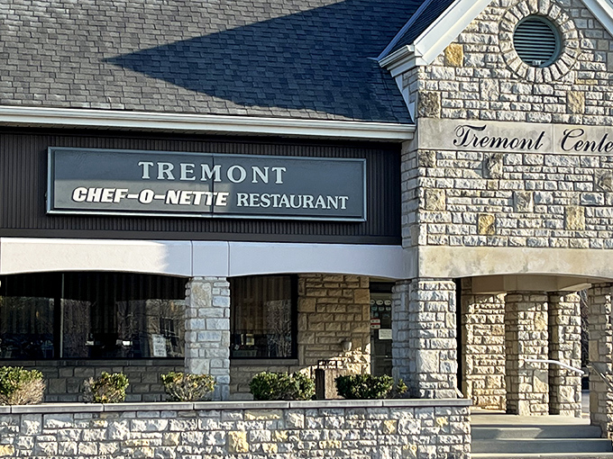 The stone facade of Tremont Center houses this beloved time capsule of American dining. Chef-O-Nette's sign promises comfort food that's stood the test of time.