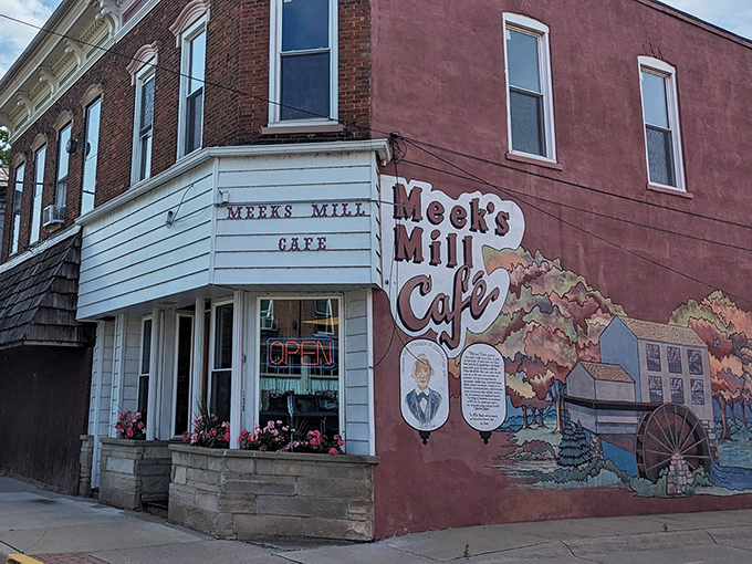 This charming exterior mural tells Constantine's story while promising culinary adventures that await inside.