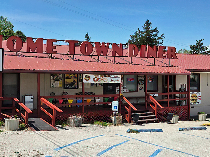 The iconic red roof and bold lettering of Home Town Diner stands as a beacon of comfort food in Hermitage, where colorful flower pots welcome hungry travelers.