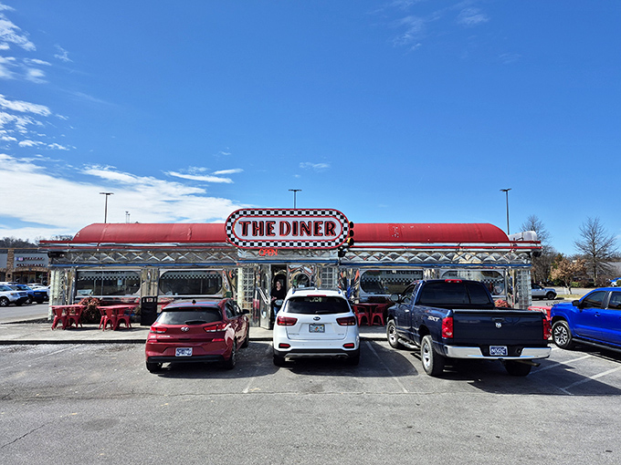 Chrome gleaming under Tennessee sunshine, The Diner's iconic red roof and checkerboard sign promise a time-traveling feast that delivers on nostalgia and flavor alike.