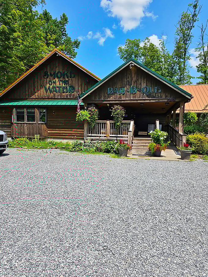 The rustic log cabin exterior of Smoke on the Water beckons like a barbecue mirage in the Appalachian wilderness. Mountain magic meets meat mastery.