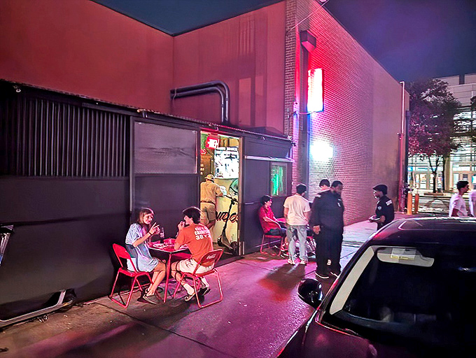Same exterior shot showing the modest brick building with its simple "TACOS" sign—proof that greatness doesn't need flashy advertising.
