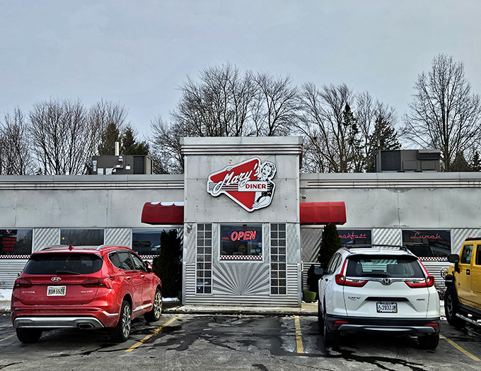 The classic white exterior with red trim announces you've arrived at comfort food paradise. Mary's Diner stands ready to transport you back in time.