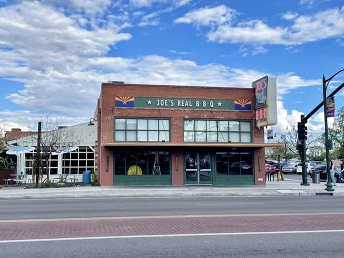 Arizona pride shines through the classic brick exterior of Joe's, where the state flag colors announce that serious barbecue has found a home in the desert.