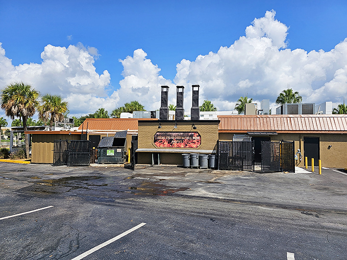 The unassuming exterior of Texas Cattle Company hides culinary treasures within. Those smokestacks aren't just for show&mdash;they're working overtime to infuse your dinner with oak-fired magic.