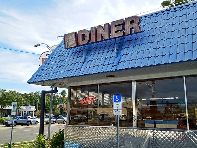 Where neon dreams and comfort food meet. The "DINER" sign has likely guided countless late-night adventurers to their breakfast salvation.