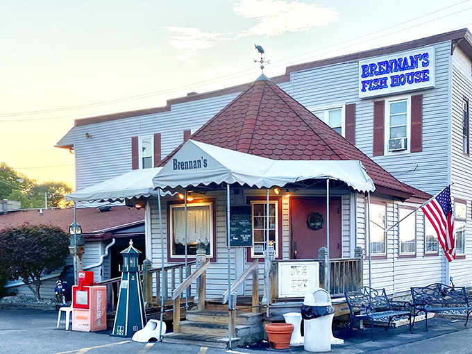The iconic turret and weathered white siding of Brennan's Fish House stand as a beacon to seafood lovers, complete with a fish weathervane that seems to say "follow me to flavor!"