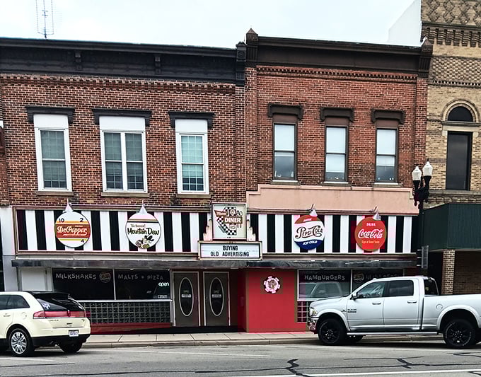 A time capsule on Main Street&mdash;Mom's Diner's iconic black and white striped awning beckons with vintage charm and the promise of comfort food perfection.