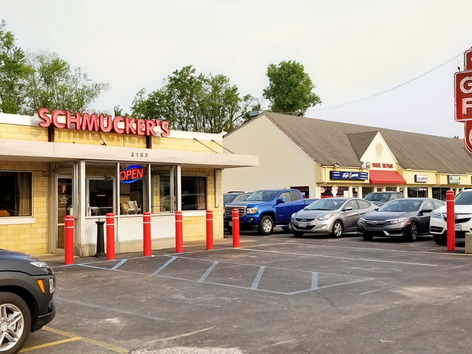 The unassuming yellow brick exterior of Schmucker's stands as a time capsule on Reynolds Road, those red bollards practically shouting, "Good food happens here!"