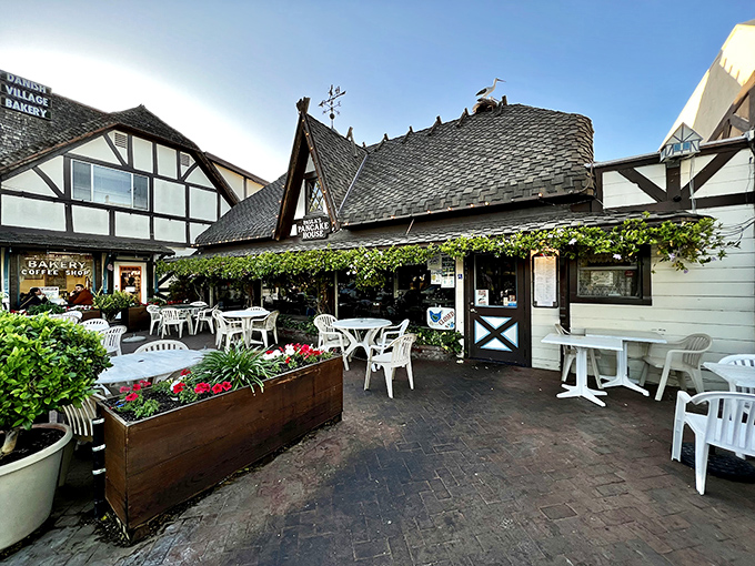 Danish architecture meets California sunshine at Paula's outdoor patio, where those distinctive pitched roofs and climbing vines create the perfect breakfast backdrop.