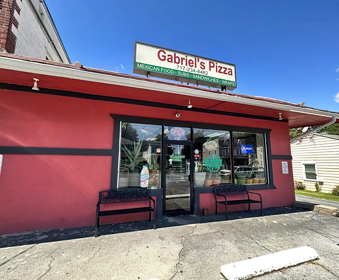 The bright red exterior of Gabriel's Pizza stands out like a culinary lighthouse on 6th Street, beckoning hungry Harrisburg locals with promises of pizza and unexpected Mexican delights.