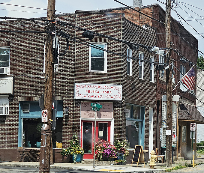 The unassuming brick corner building with its vibrant red doors beckons like a secret Polish embassy in Pittsburgh's urban landscape.