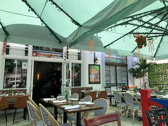 Welcome to flavor paradise, where the Cuban flag flies proudly and promises of pressed perfection await inside.