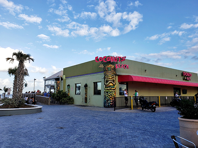 The turquoise beacon of beachside bliss! Coconuts on the Beach announces itself with tiki flair and a color scheme that screams "vacation mode activated."