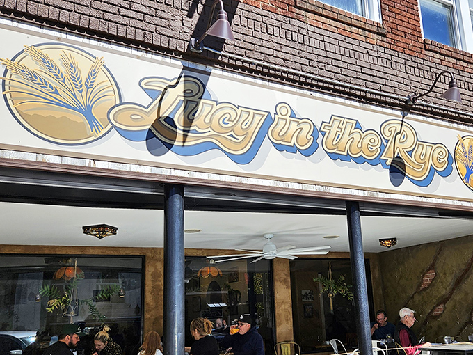 The storefront beckons like a literary wink – Lucy in the Rye's golden wheat logo promising carb-laden poetry for your taste buds.