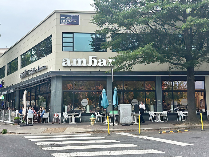 AMBAR's sleek exterior beckons from its Clarendon corner, promising Balkan delights within. Those outdoor tables? Prime real estate for people-watching while sipping rakija.