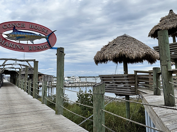 The entrance to paradise isn't pearly gates, but a wooden boardwalk leading to thatched huts where seafood dreams and waterfront views become reality.