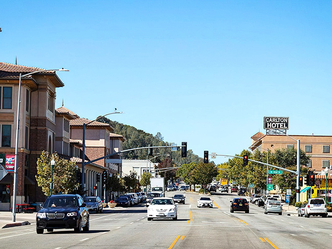 El Camino Real stretches through downtown Atascadero like a ribbon of possibility, with the iconic Carlton Hotel standing sentinel over small-town dreams.