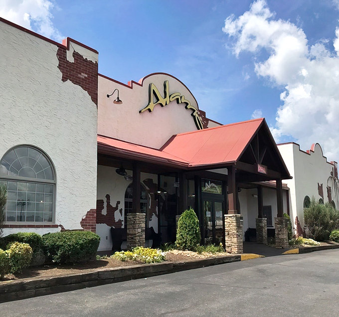The Alamo Steakhouse's glowing entrance stands like a beacon for hungry travelers, promising refuge from mediocre meals and salvation for empty stomachs.