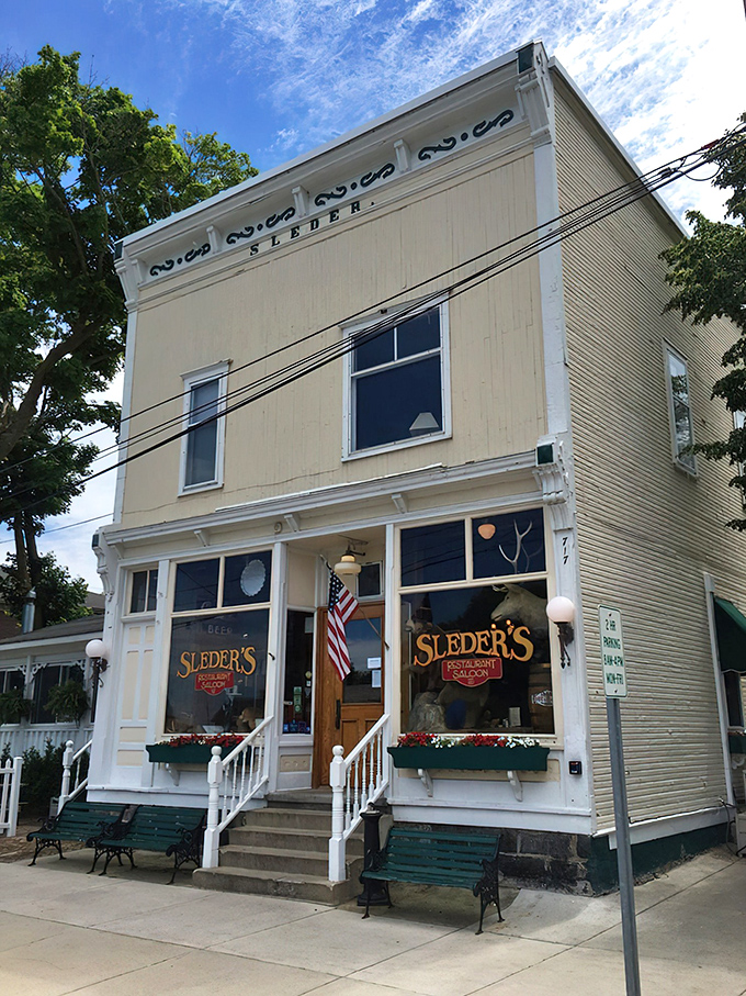 The white clapboard exterior of Sleder's stands like a time capsule in Traverse City's Slabtown neighborhood. Those green benches have witnessed countless post-meal conversations.