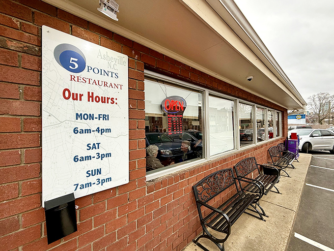 The brick facade of Five Points Restaurant stands as a humble invitation to one of Asheville's most beloved breakfast institutions. Those benches aren't just decoration&mdash;they're for the patient breakfast pilgrims.