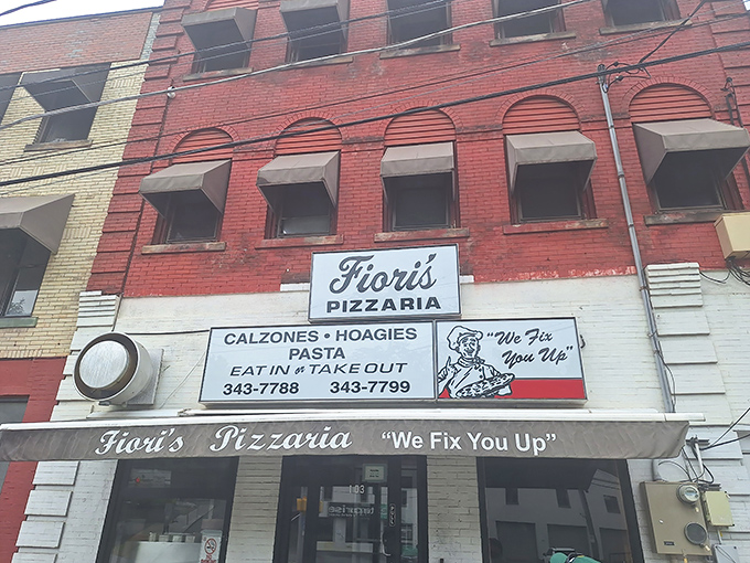 The unassuming brick facade of Fiori's promises something magical with its vintage charm and bold claim: "We Fix You Up." Pizza therapy awaits inside.