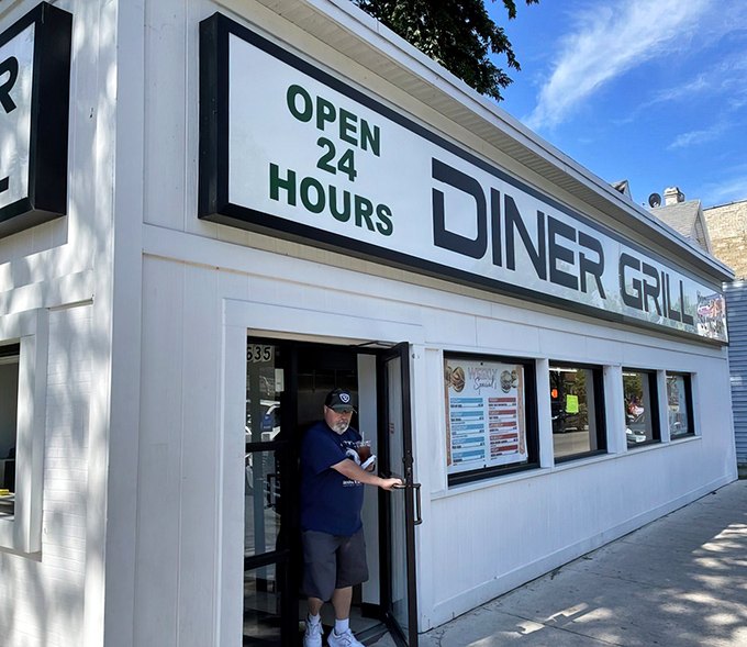 The white facade proudly announces "Home of the SLINGER" – a promise that's both a challenge and a comfort to Chicago night owls and early birds alike.