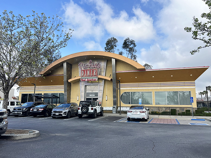 Richie's Diner stands proud with its distinctive curved roof and bold signage, like a beacon of comfort food calling to hungry travelers on California highways.