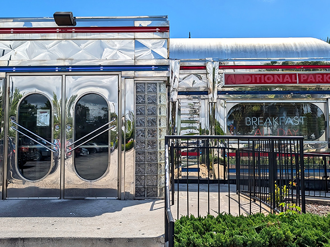 That iconic silver exterior with bold red lettering isn't just announcing a diner&mdash;it's promising a time-traveling culinary adventure in Dania Beach.