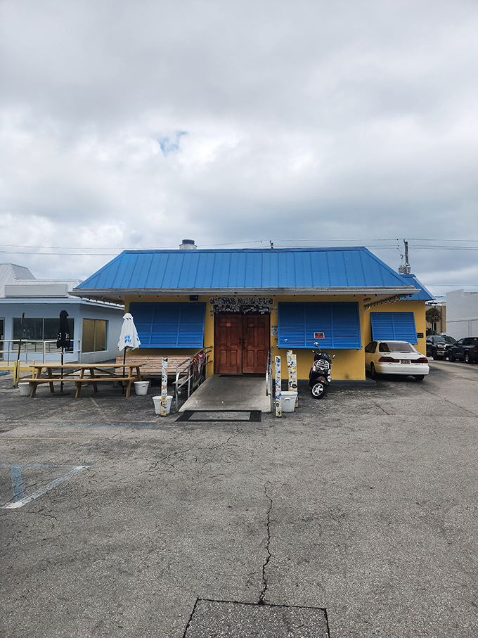 The unassuming yellow exterior with bright blue roof might fool you, but locals know this modest building houses burger perfection. No fancy frills needed. 