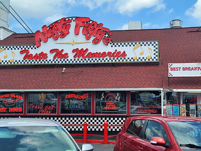 The classic red and white exterior of Nifty Fifty's stands like a beacon of nostalgia, promising comfort food that'll make your cardiologist wince and your taste buds sing.