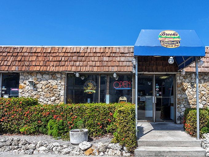 The unassuming stone exterior with its bright blue awning is like that friend who doesn't brag but then casually mentions they once saved a dolphin.