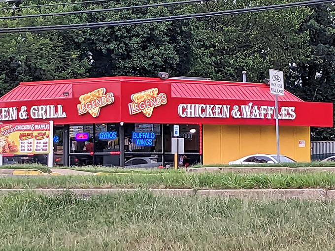 Neon signs glow like culinary bat signals, broadcasting the message that comfort food of heroic proportions awaits inside this unassuming yellow building.