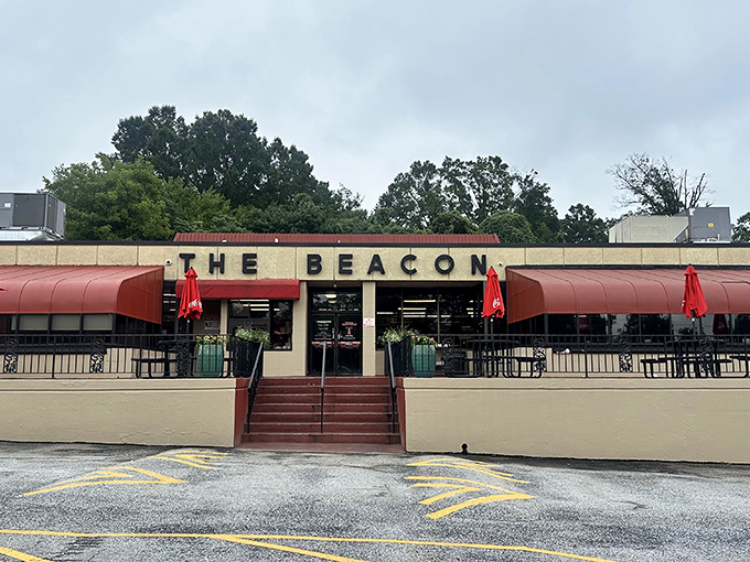 The iconic red awnings of The Beacon beckon hungry travelers like a lighthouse for the famished. Southern comfort food paradise awaits.