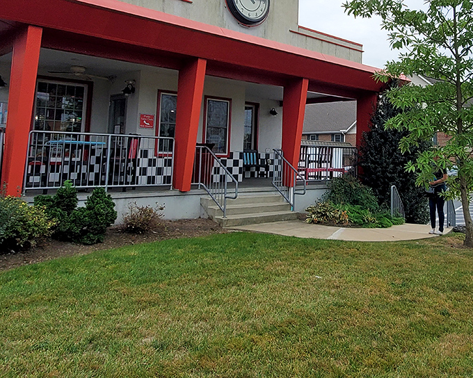 That checkerboard porch railing isn't just decorative&mdash;it's your first clue that you've found a place where nostalgia and flavor hold equal importance.
