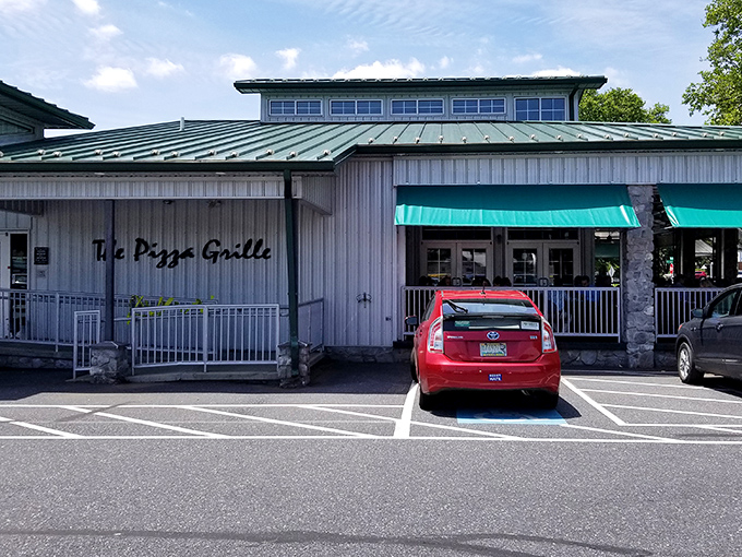 The Pizza Grille's distinctive green awnings and white exterior create that "where have you been all my life?" feeling as you pull into the Camp Hill parking lot.