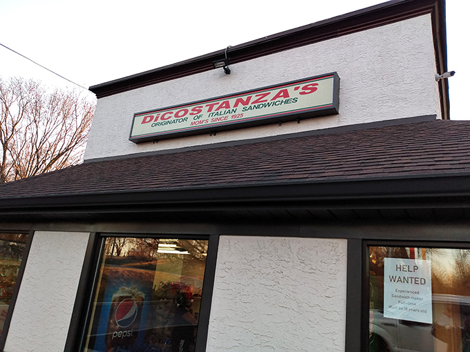 The unassuming white building with its bright yellow bollards stands like a sandwich sentinel, guarding hoagie perfection within its humble walls.