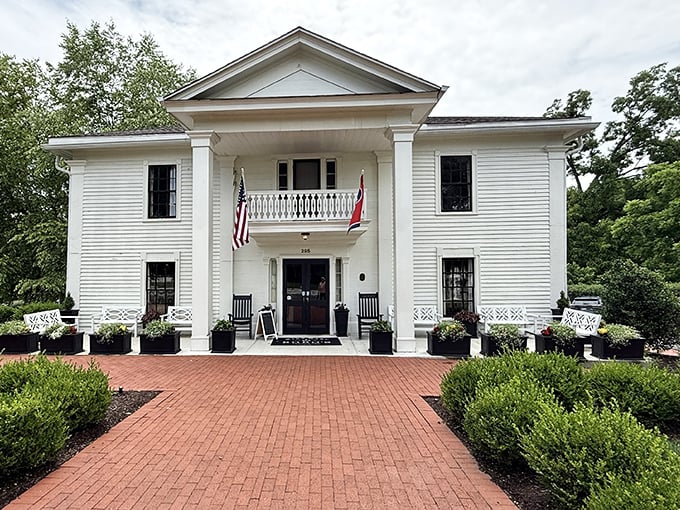 Southern elegance personified! This stately white colonial with its welcoming porch and rocking chairs practically whispers "come on in and stay awhile."