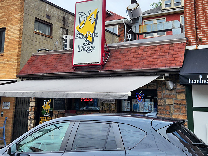 The unassuming storefront of D's Six Pax and Dogz hides a culinary treasure within. Sometimes the best food adventures begin with modest exteriors.