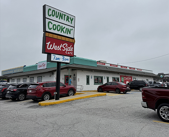 The unassuming exterior of West Side Cafe stands as a beacon of comfort food promise, with its cheerful red signage announcing culinary treasures within.