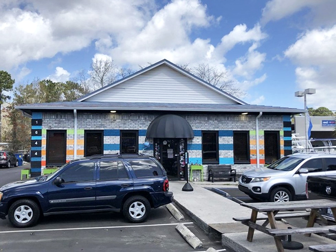 The colorful brick exterior of Early Bird Diner stands out like a cheerful greeting card. Those blue and orange stripes promise something more exciting than your average breakfast joint.