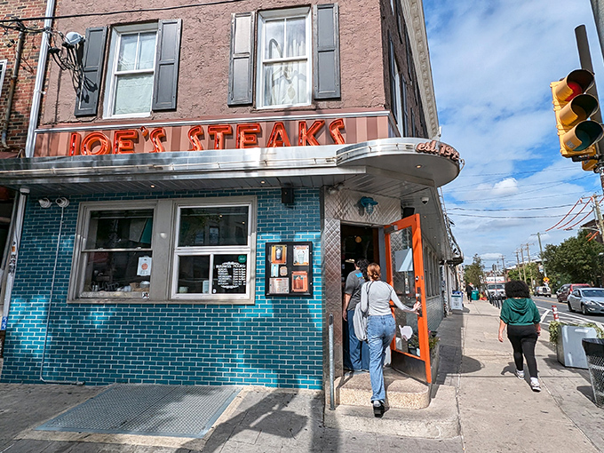 The iconic turquoise-tiled exterior of Joe's Steaks + Soda Shop stands as a beacon of culinary nostalgia in Fishtown, promising delicious adventures within those retro walls.